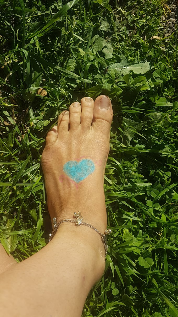 Write your name, message or logo on my feet by Naamor | Fiverr